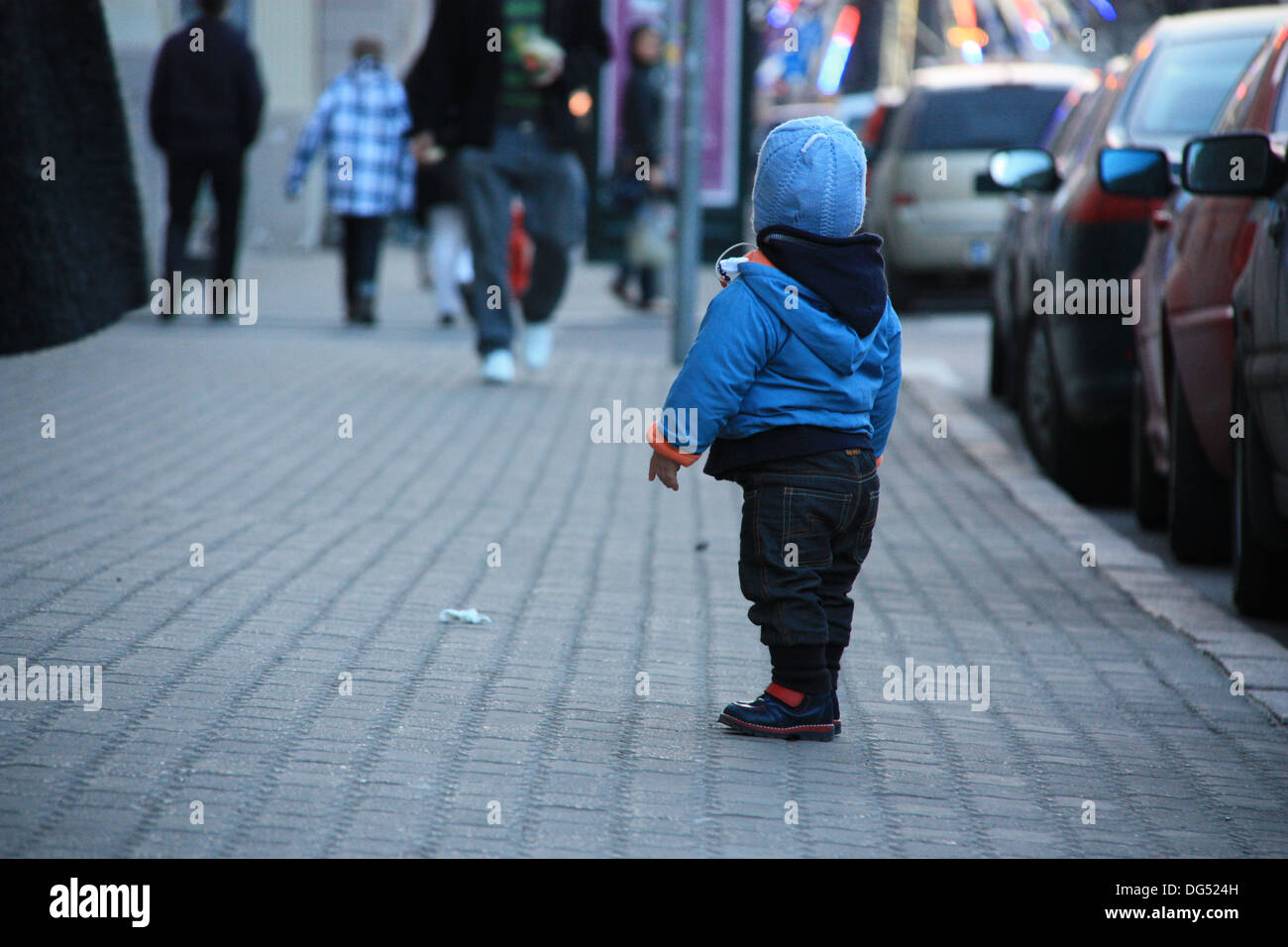Baby on the street Stock Photo - Alamy