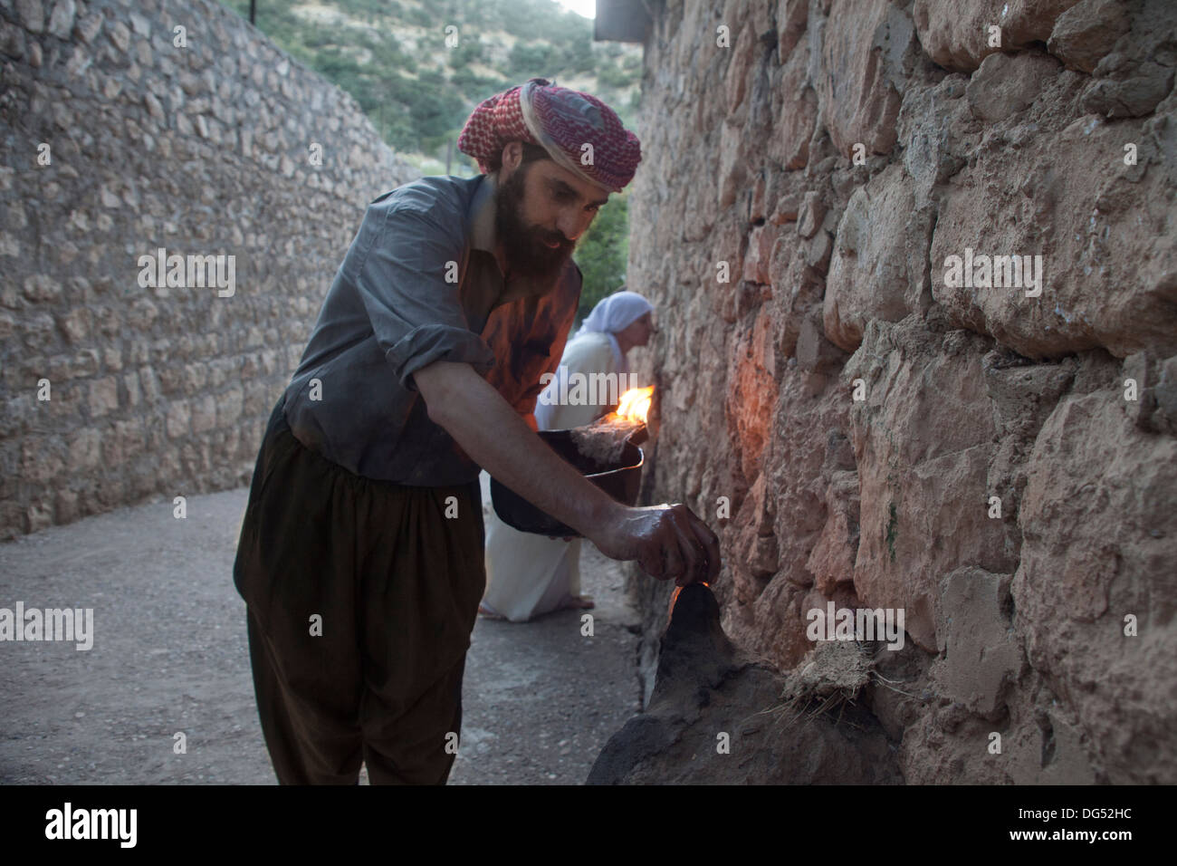 Lalish, Yazidi Holy city in Northern Iraq - Holy man lighting the ...