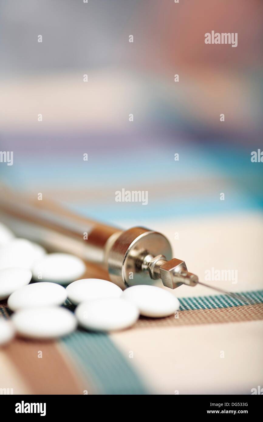 syringe and vial of medication on a the table Stock Photo - Alamy