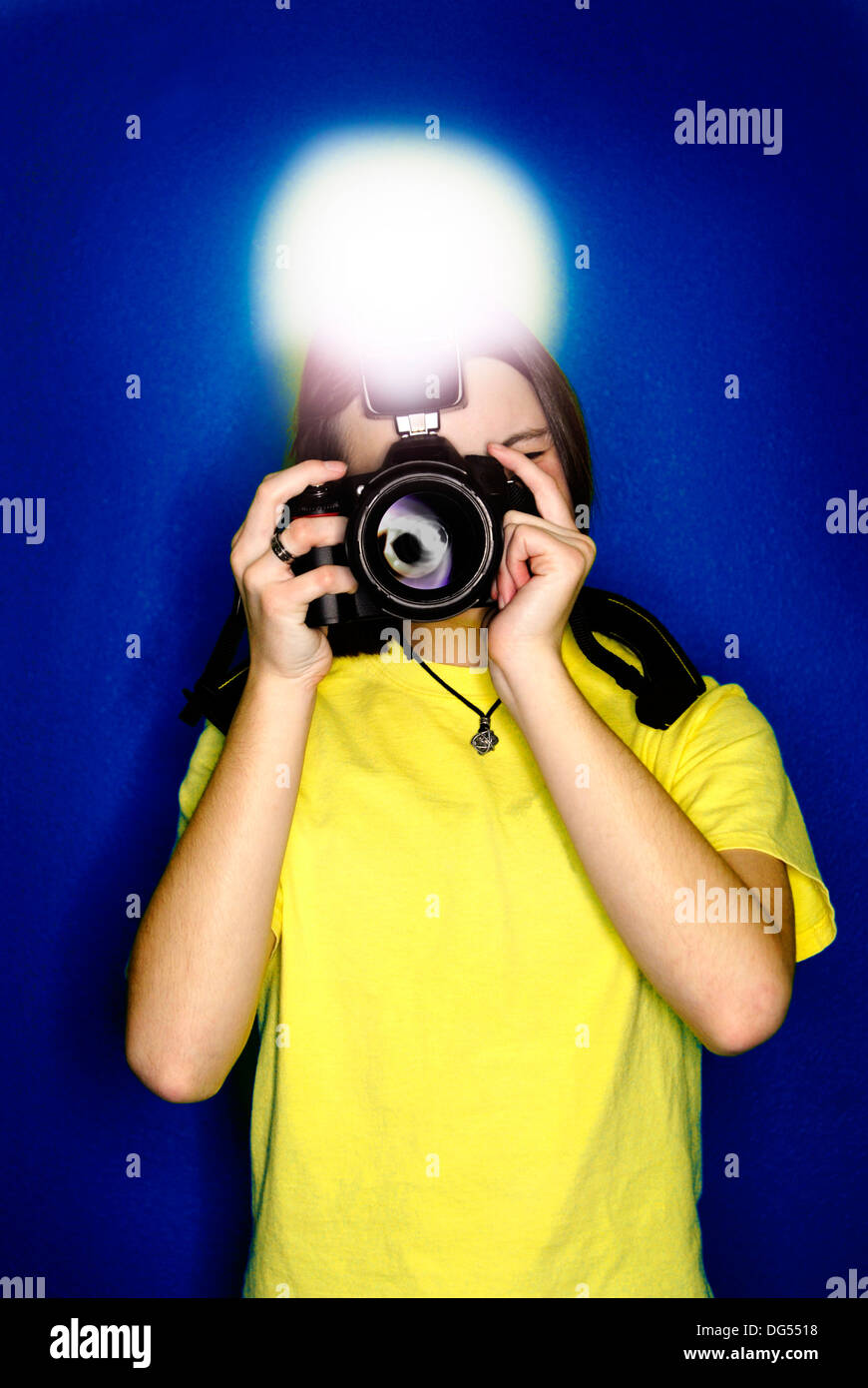 Girl photographer taking photo with digital camera and flash Stock ...