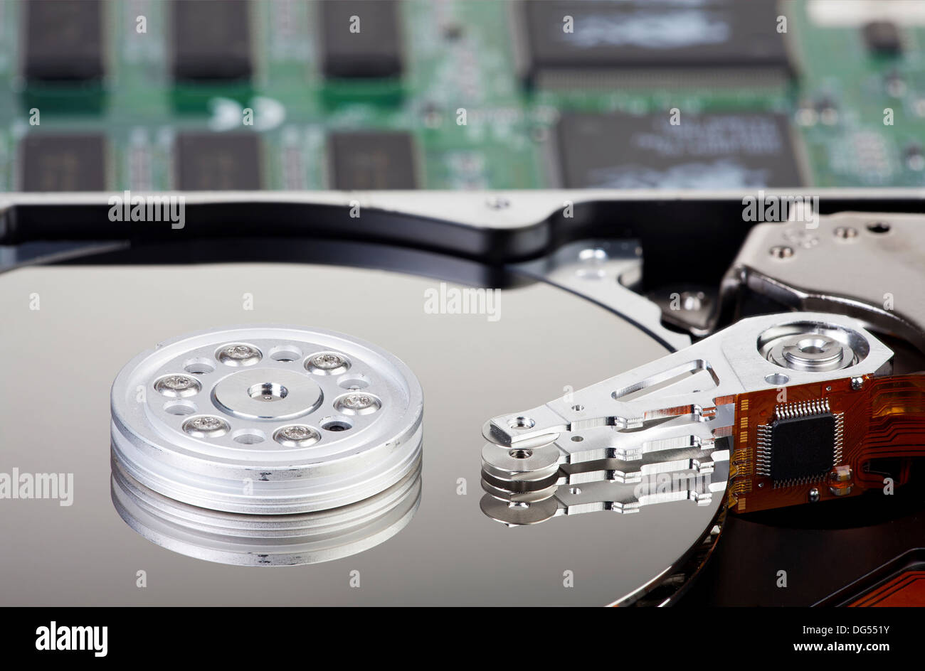 Detailed Picture of an opened hard disk with a computer circuit board ...