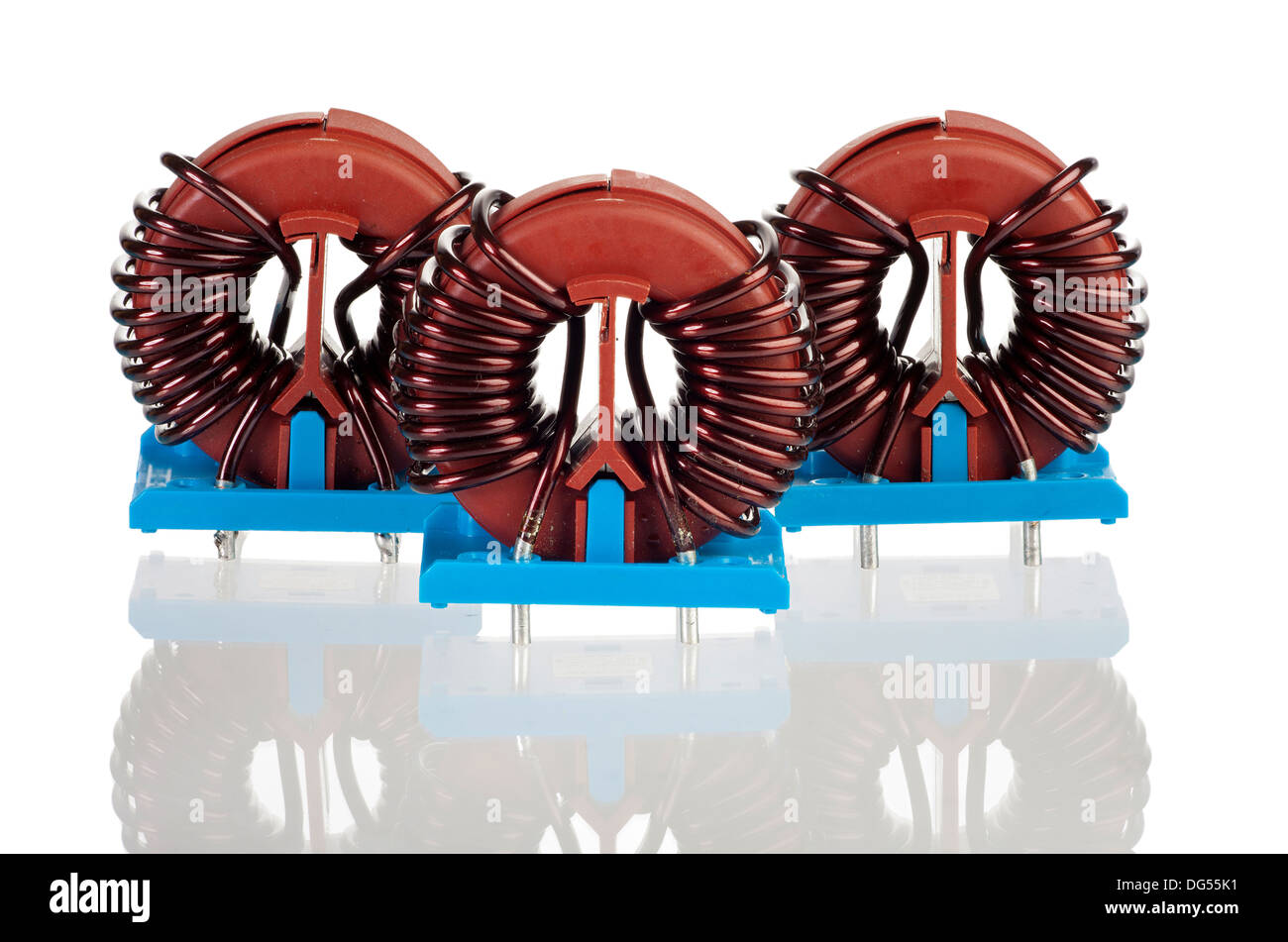 Three Industrial Toroidal Choke Coil isolated and reflected on White ...