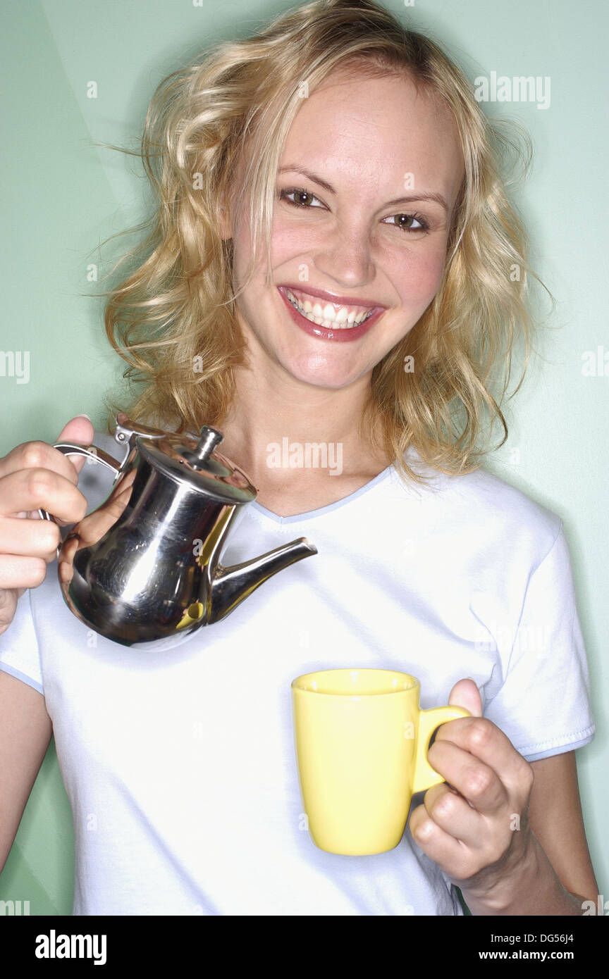 Woman and drinking tea and funny face hi-res stock photography and ...