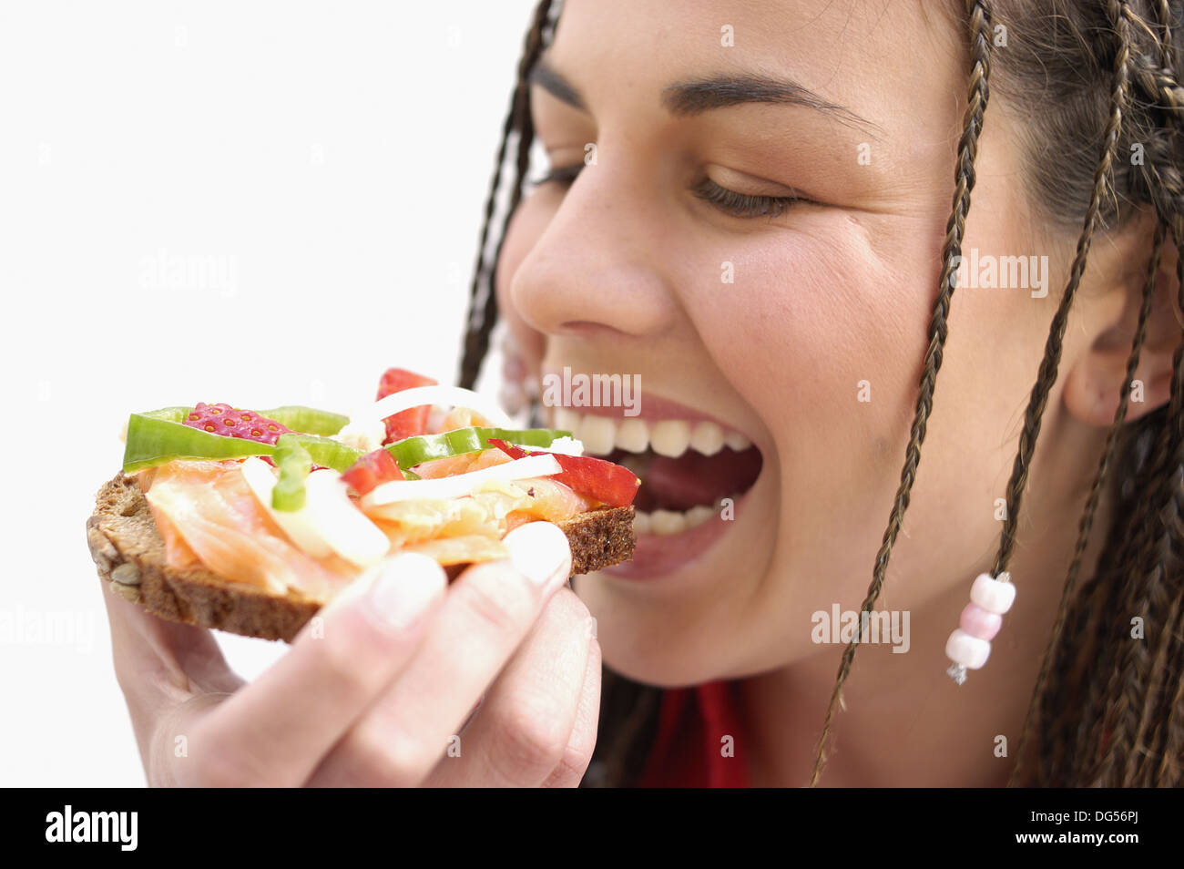 Closeup woman eating toast Stock Photo - Alamy