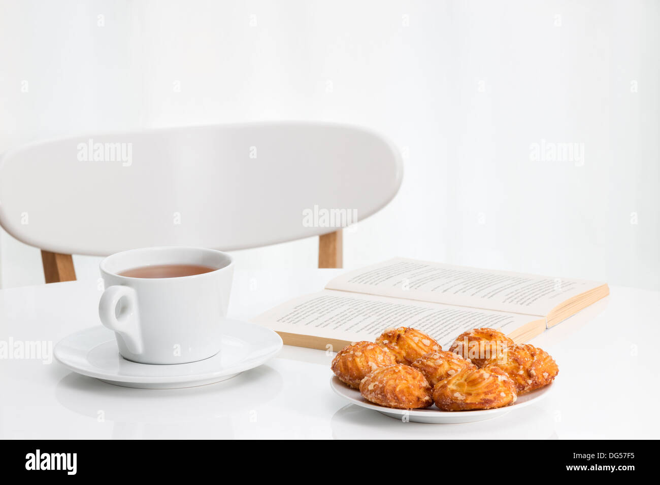 Cup of tea, cookies and a book to read Stock Photo - Alamy