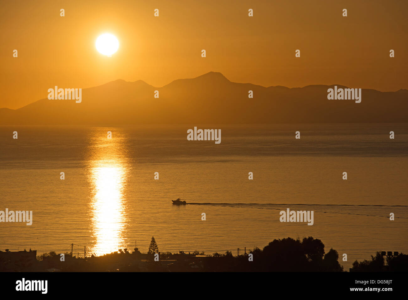 AEGEAN, GREECE. Sunrise over the Cycladic island of Anafi, as seen from ...