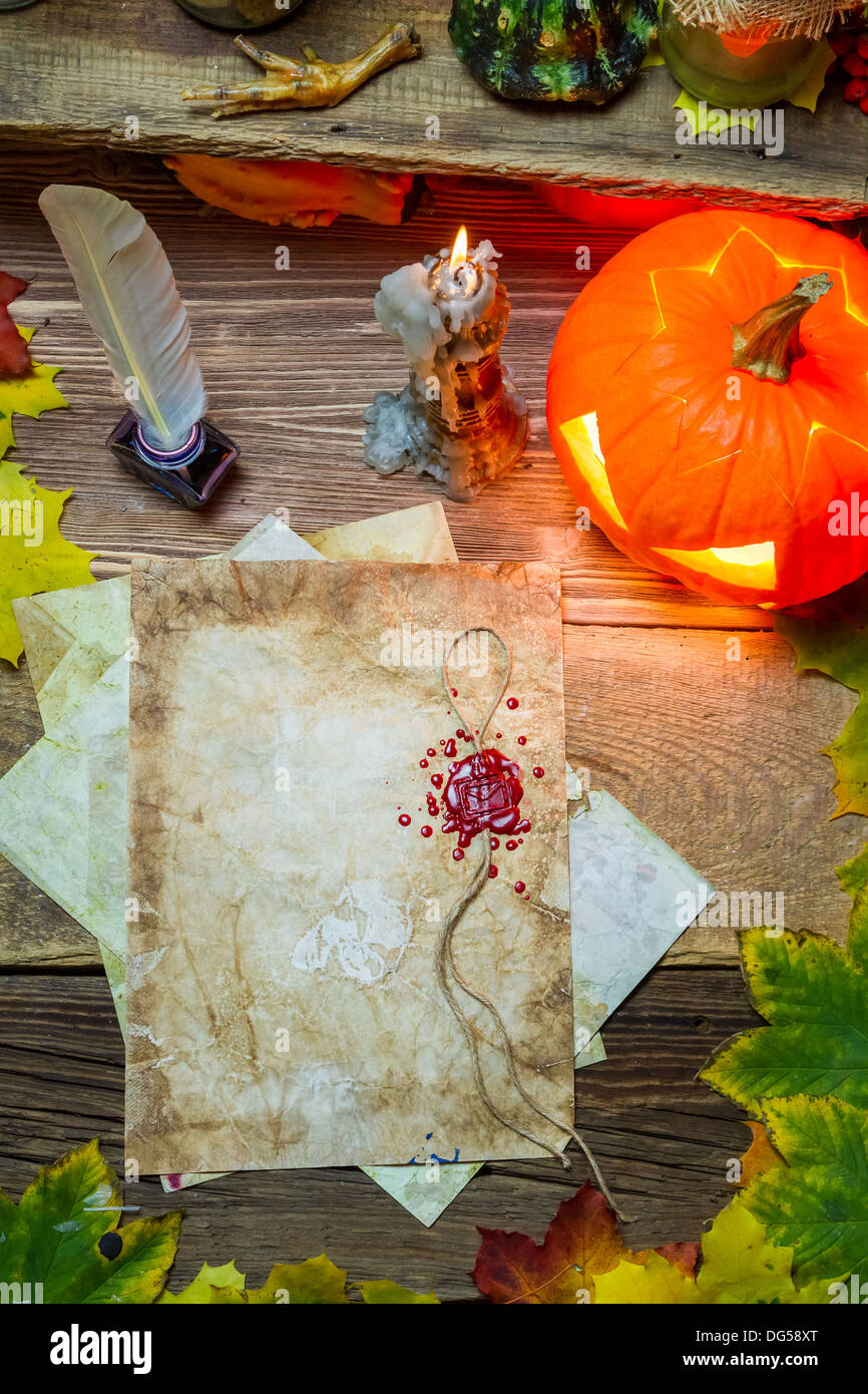 Preparing to write the scroll on table witches Stock Photo - Alamy