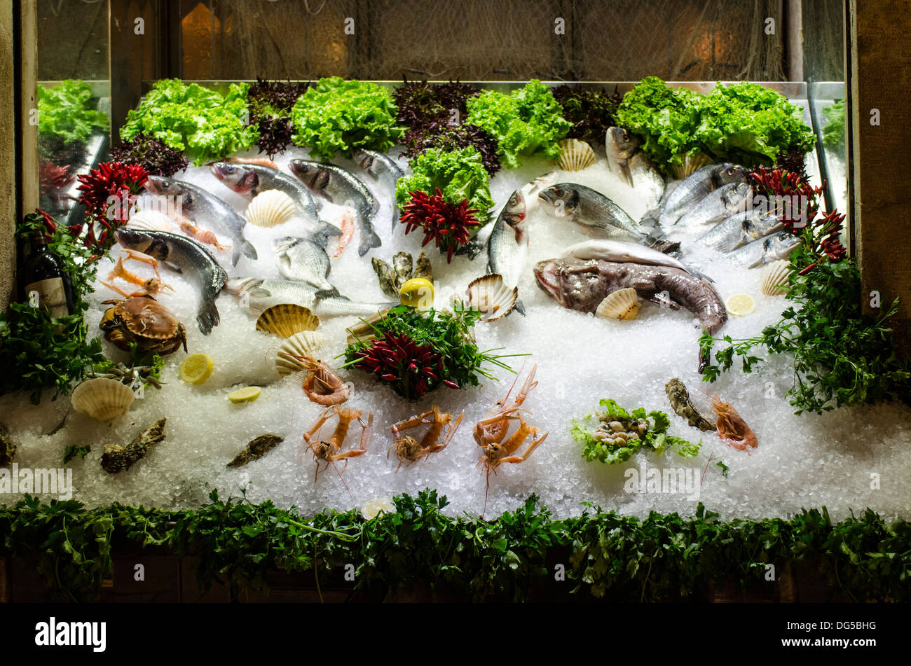 Fish and seafood on ice in a window display in Venice, Italy. The Stock ...