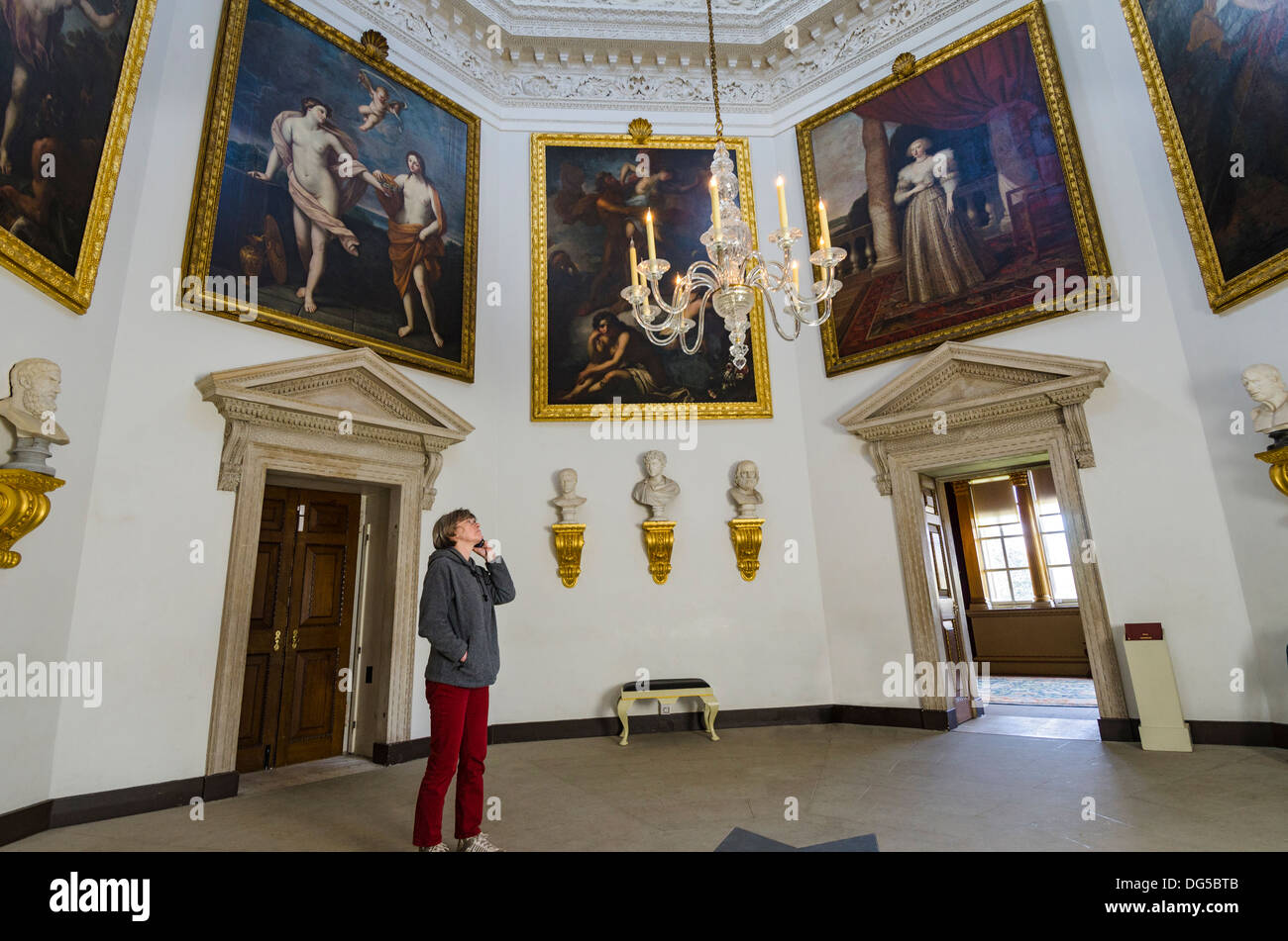 Visitor listening to a recorded commentary guide while viewing the ...