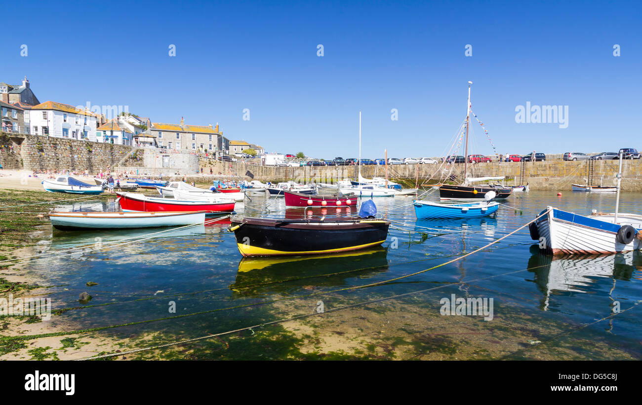 Summer at the historic fishing harbour Mousehole Cornwall England UK ...