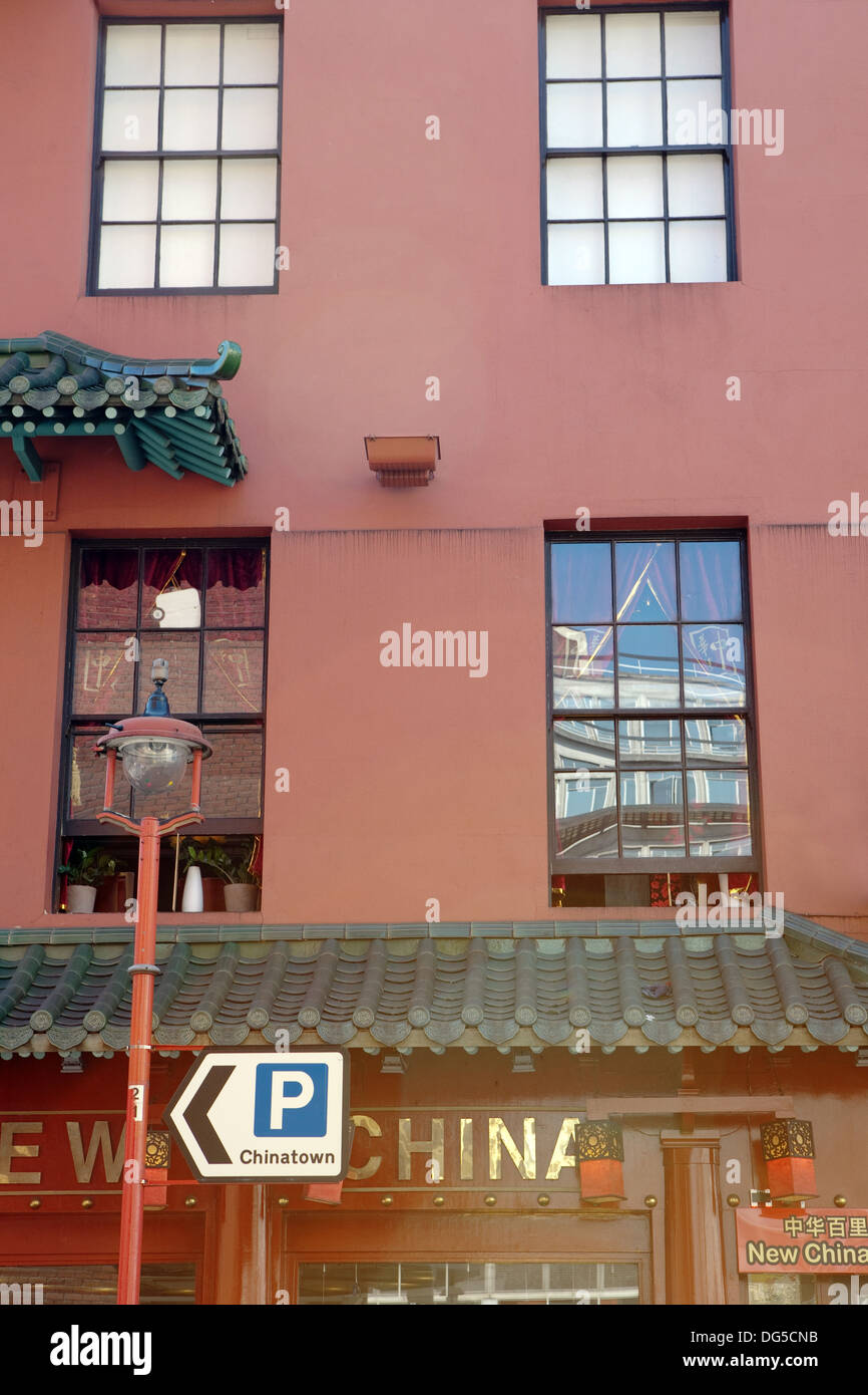 Parking sign in Chinatown, London outside Chinese shop with lens flare ...