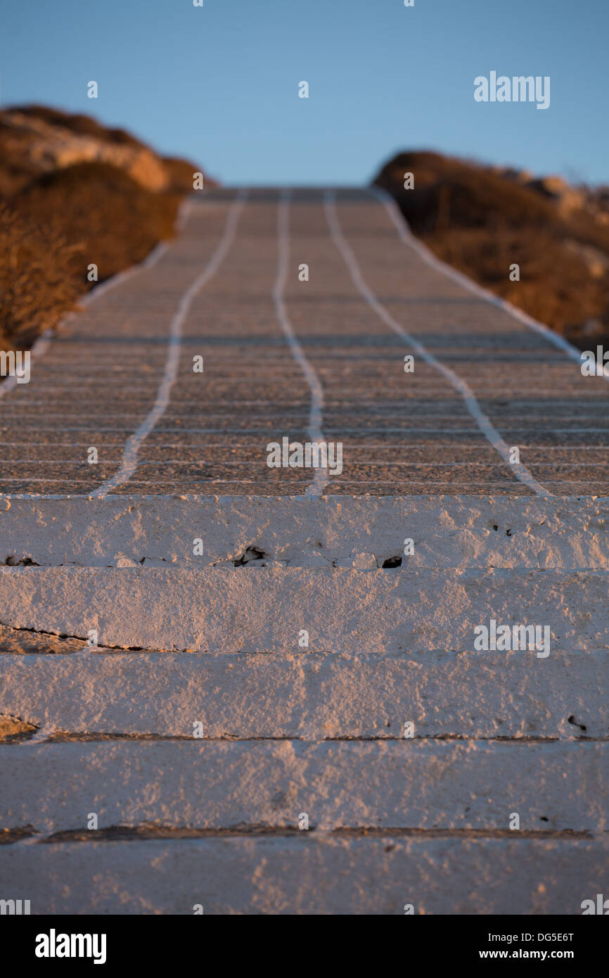 Traditional stone walkway to the aegean sea. At a Path to a very ...