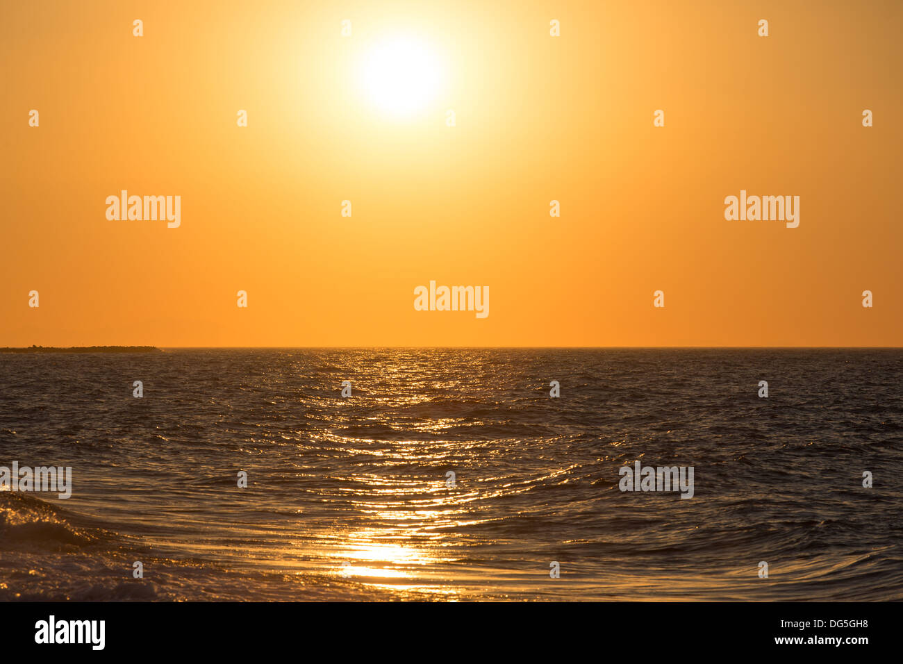Beautiful sunset at the beach of Santorini in Greece Stock Photo - Alamy