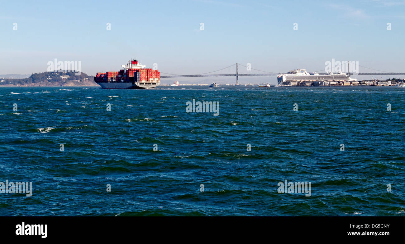 Container ship on San Francisco Bay with Bay Bridge and cruise ship in ...