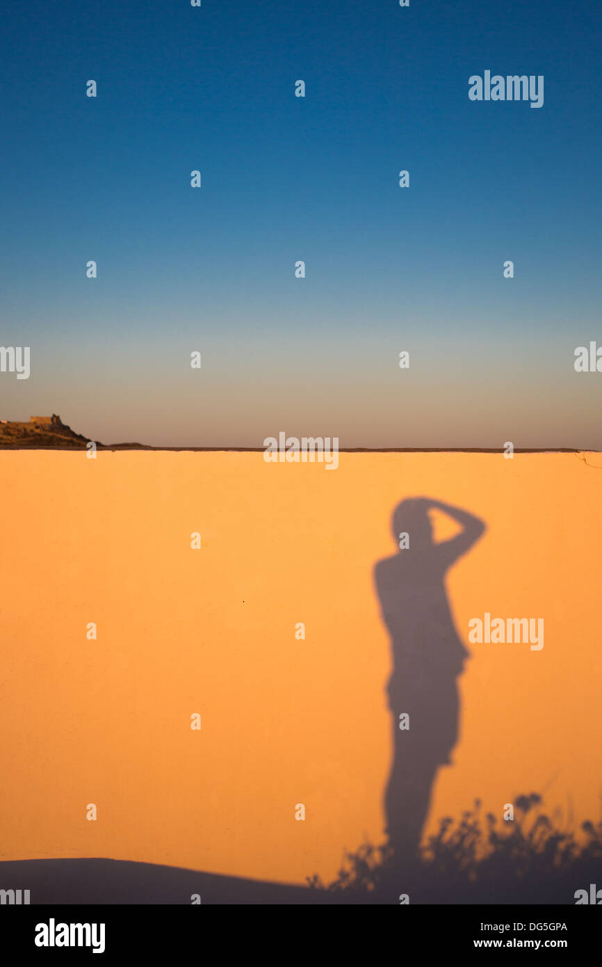Shadow of a man taking a picture and a fantastic view of the greek and ...