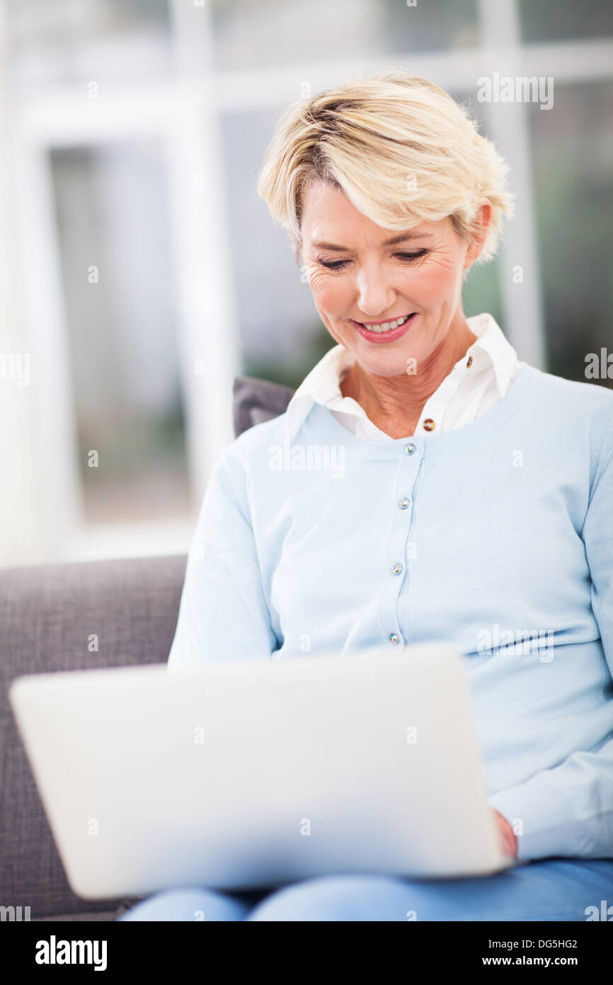 elegant middle aged woman using laptop computer at home Stock Photo - Alamy