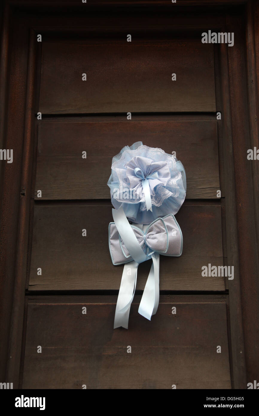 new born baby blue ribbon on door in rome italy Stock Photo - Alamy