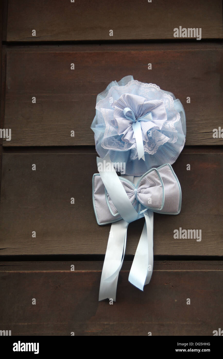 new born baby blue ribbon on door in rome italy Stock Photo - Alamy