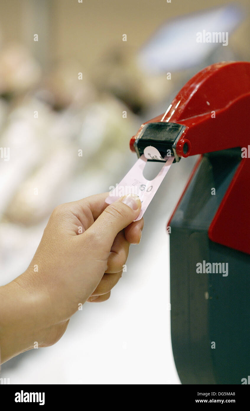 Waiting ticket dispenser hi-res stock photography and images - Alamy