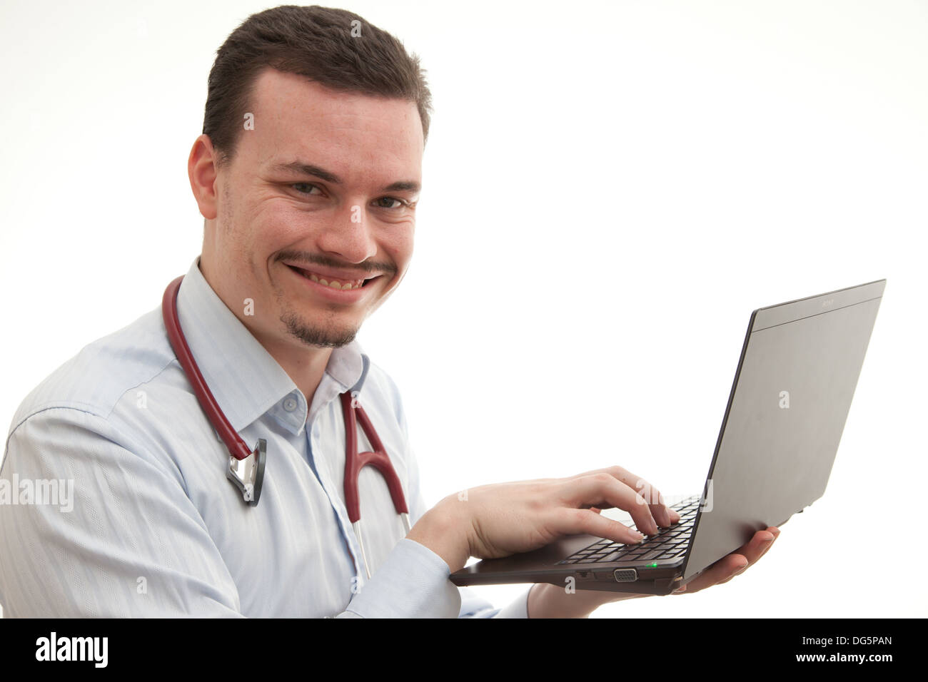 Doctor man holding laptop happy look hi-res stock photography and ...