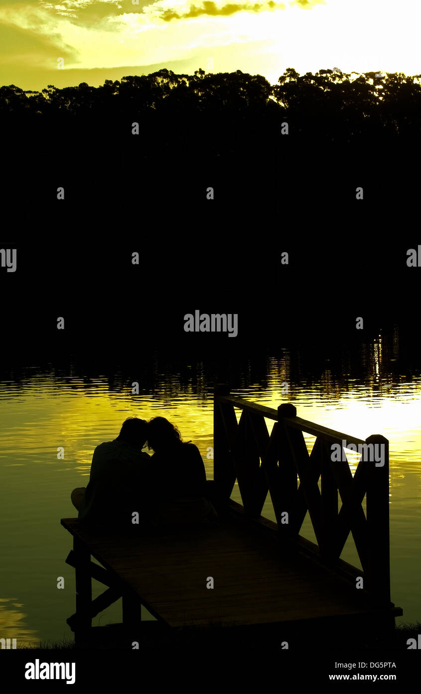 Silhouette people sitting on jetty hi-res stock photography and images ...