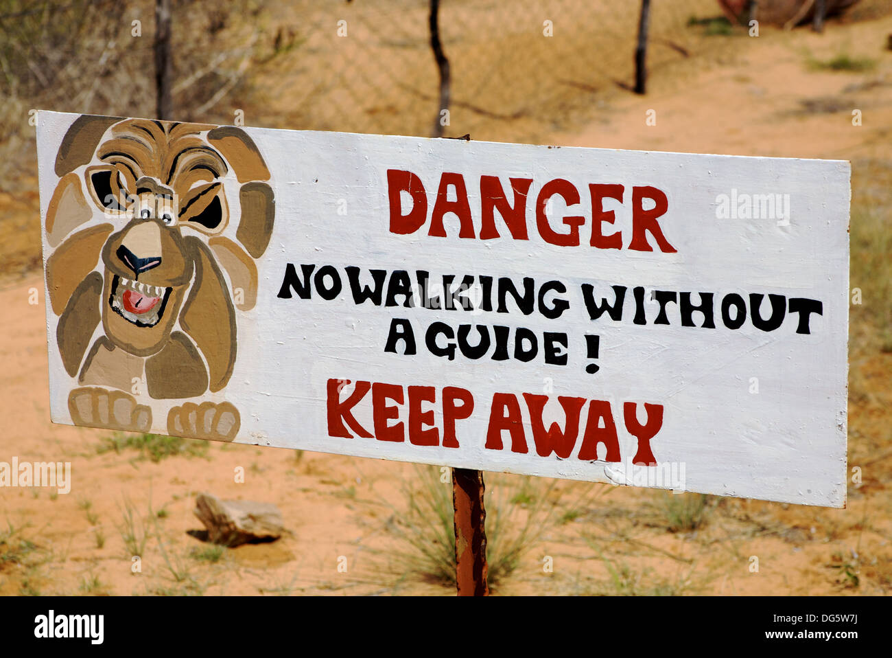 Danger lion signboard on fence in Namibia Stock Photo - Alamy