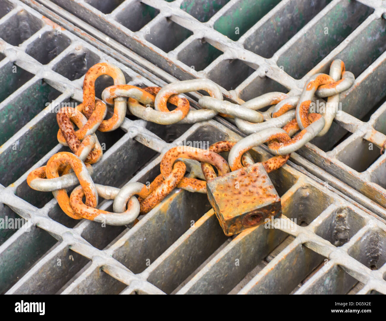 Lock and chain on a steel ,Close up view of a large lock and chain on a ...
