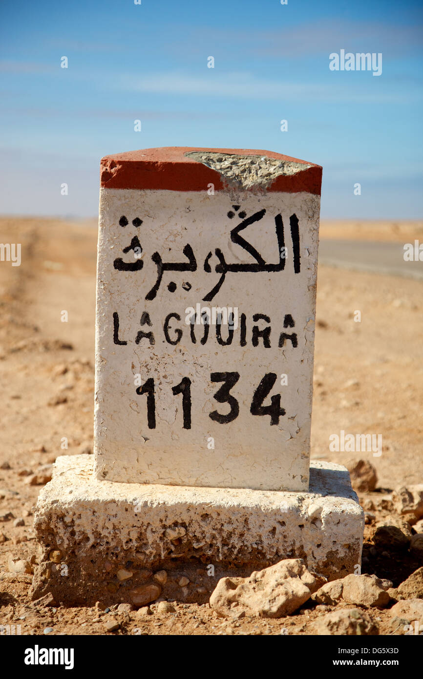 Road Sign to Lagouira in Morocco with blue sky Stock Photo - Alamy