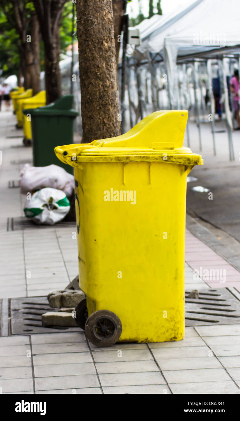 Yellow rubbish bin Stock Photo - Alamy