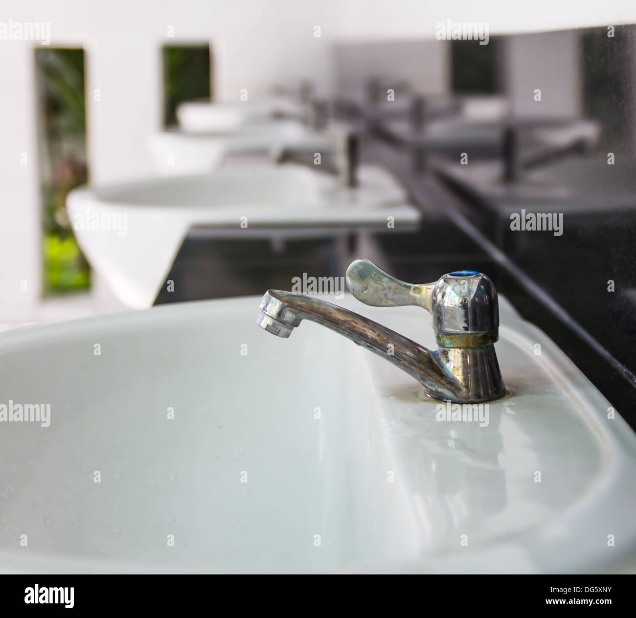 Faucet close up at public toilets Stock Photo - Alamy