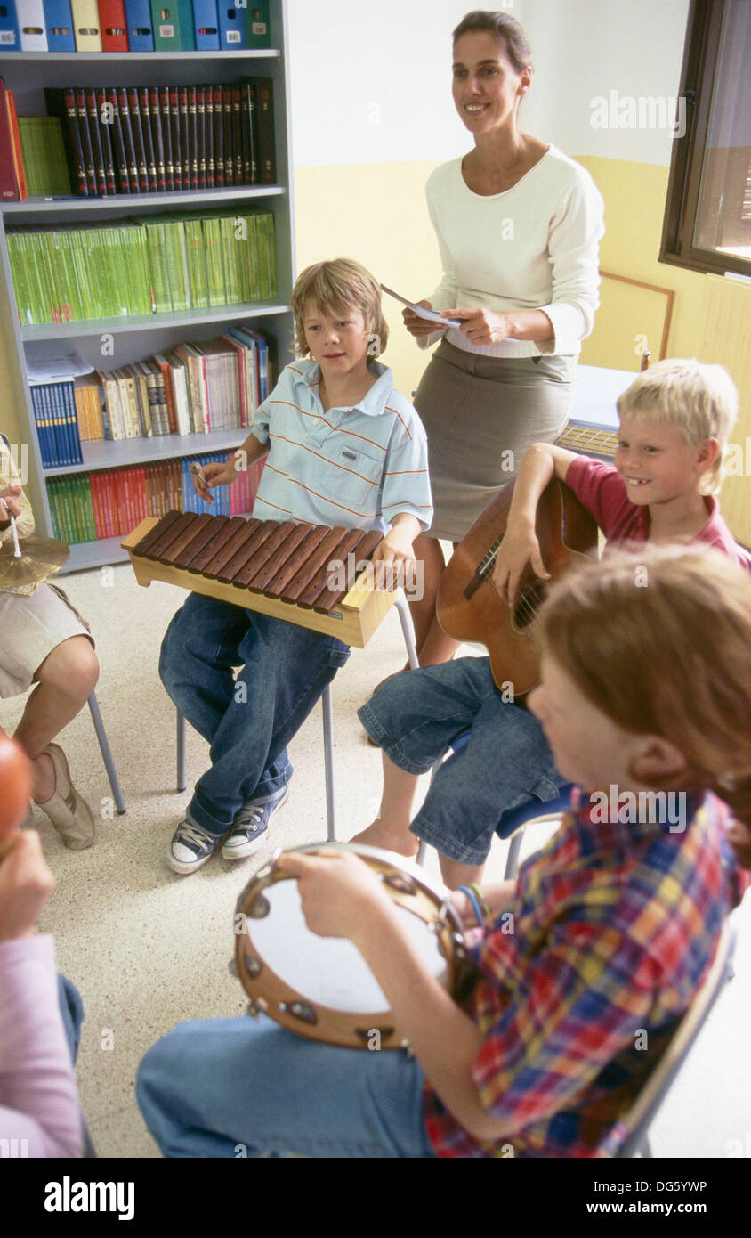 School children playing percussion instruments hi-res stock photography ...