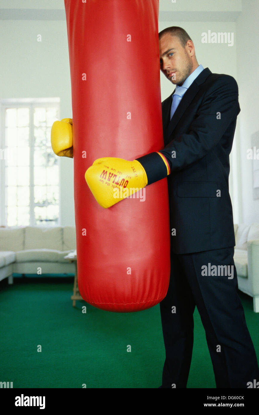 Punching bag man suit hi-res stock photography and images - Alamy
