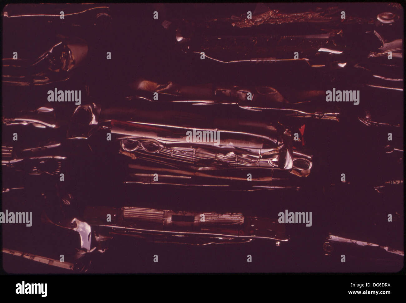 An auto shredder at Fields Point processes flattened cars, transforming ...
