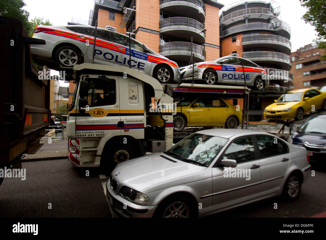 15th October 2013. London UK. Two police cars are being transported on ...