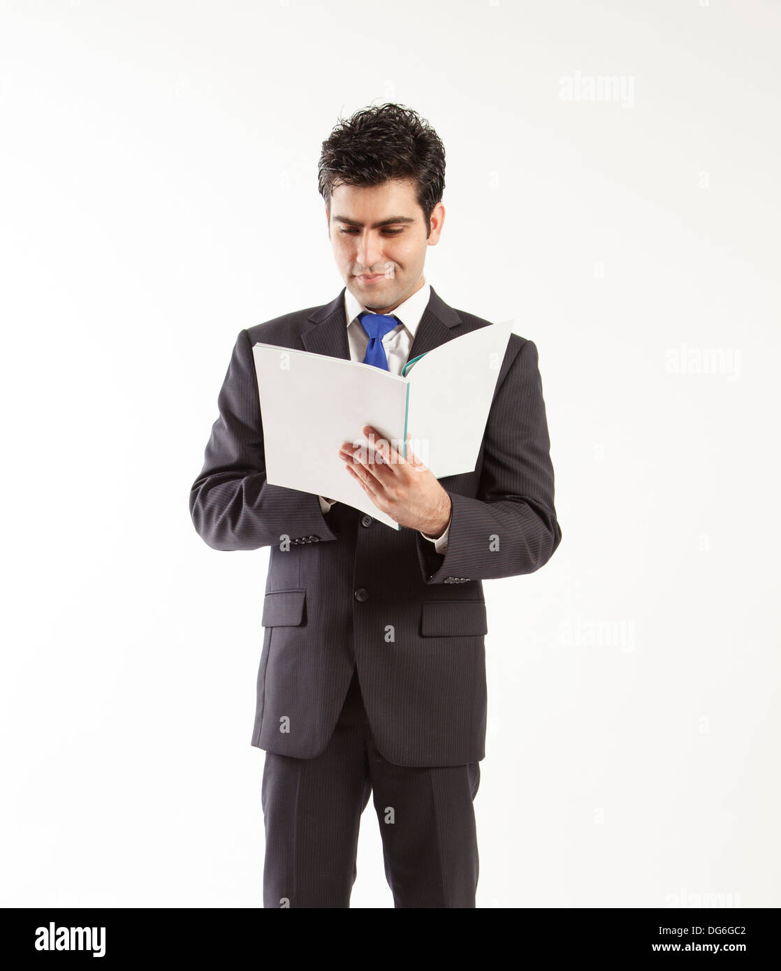 Bussiness man reading book Stock Photo - Alamy