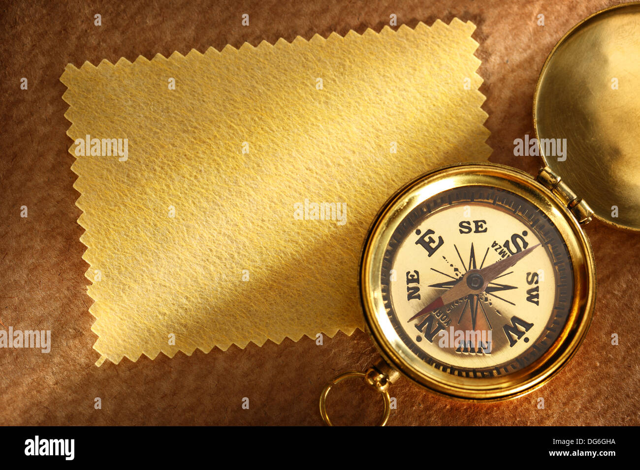 Blank yellow card and compass Stock Photo - Alamy
