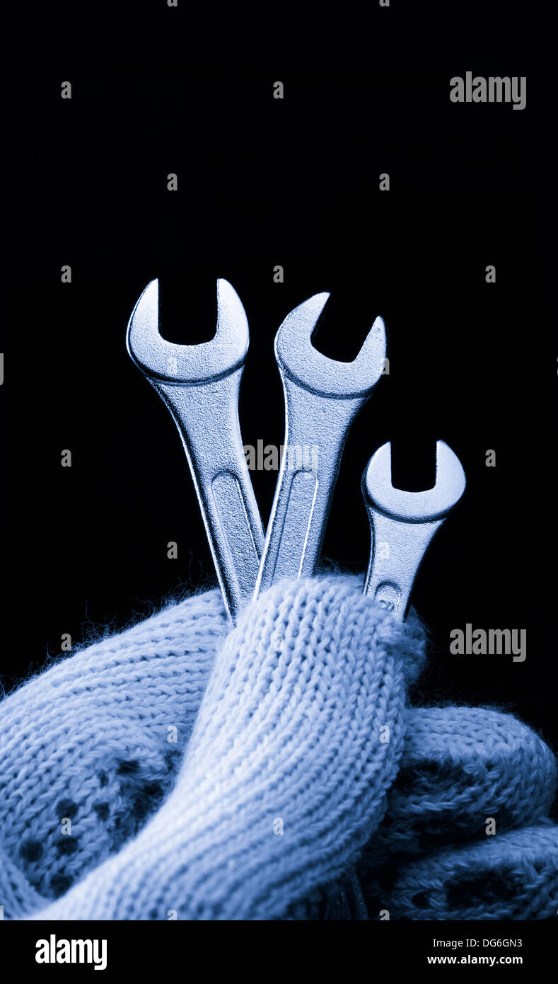 Hand with wrenches hi-res stock photography and images - Alamy