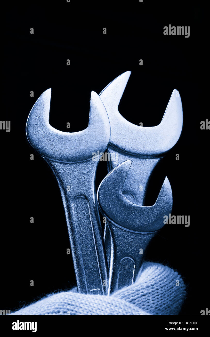 Hand with wrenches hi-res stock photography and images - Alamy