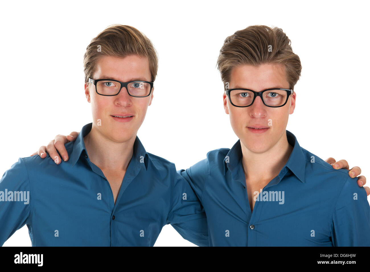 Identically adult male twins in studio Stock Photo - Alamy