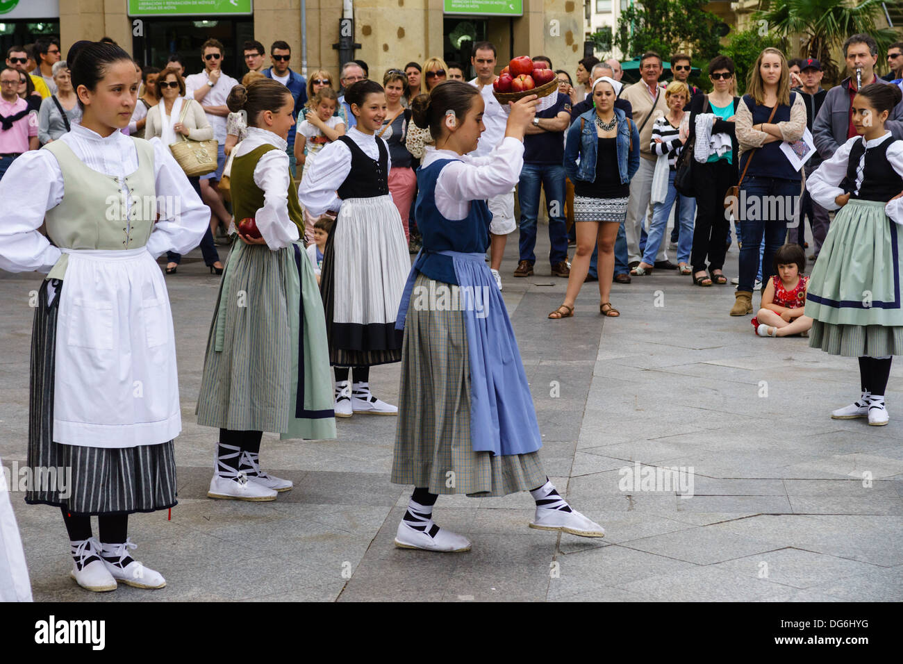 Girls do Basque cider apple harvest folk dance in San Sebastian ...