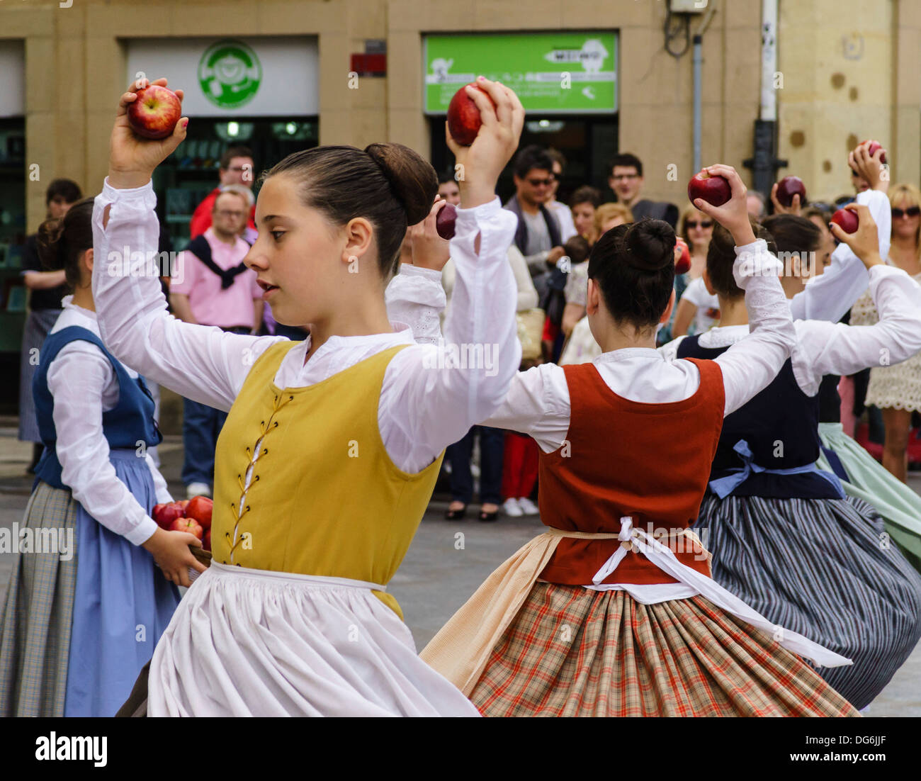 Girls do Basque cider apple harvest folk dance in San Sebastian ...