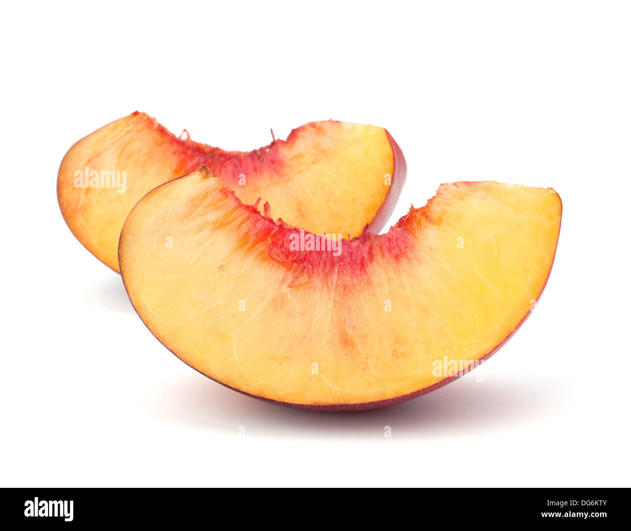 Nectarine fruit segments isolated on white background Stock Photo - Alamy
