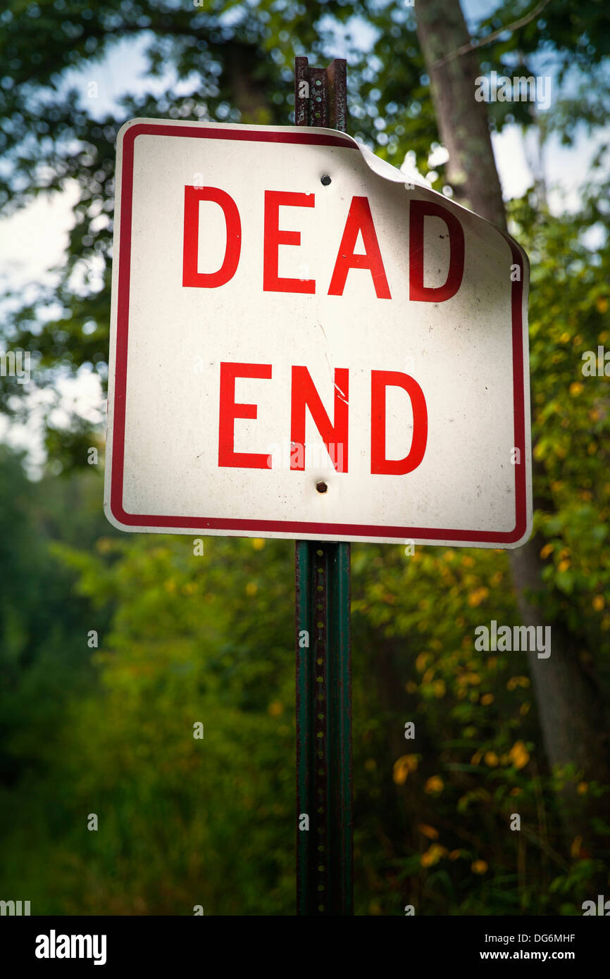 Bold red dead end sign marks the end of the road Stock Photo - Alamy