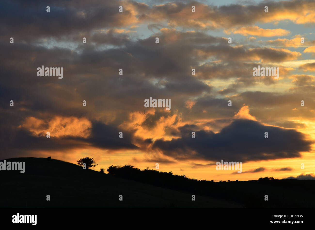 Ivinghoe hills silhouette with rain clouds & sunset Stock Photo - Alamy