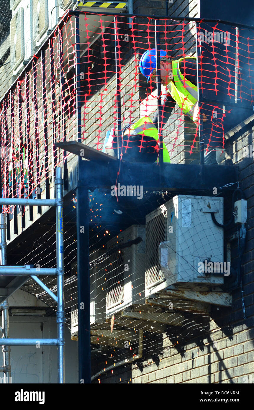 construction worker's repair welding a fire escape Stock Photo - Alamy