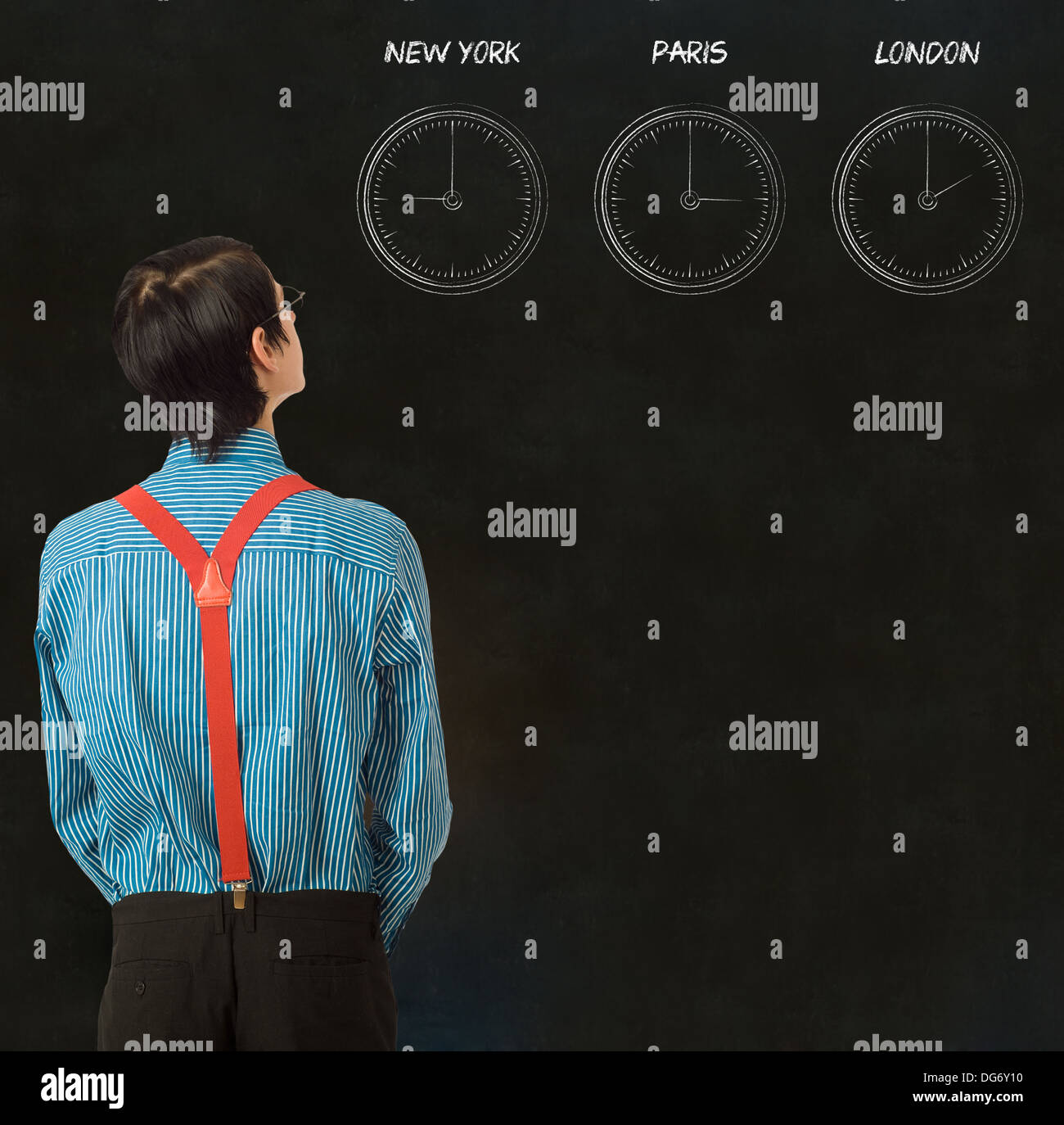 Nerd geek businessman with chalk time difference clocks on blackboard ...