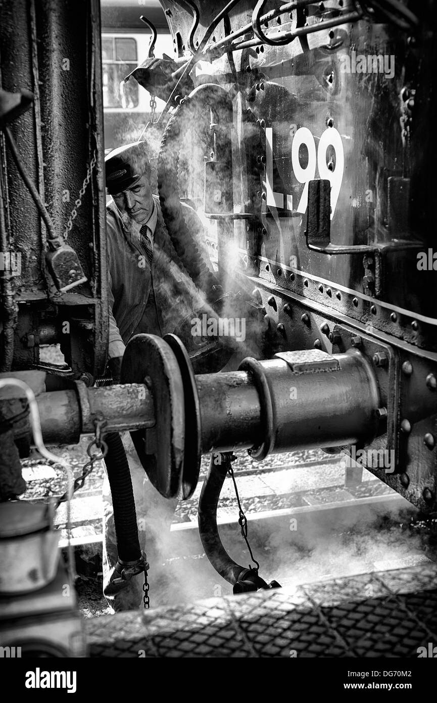 steam railway engineer coupling the steam engine Stock Photo - Alamy