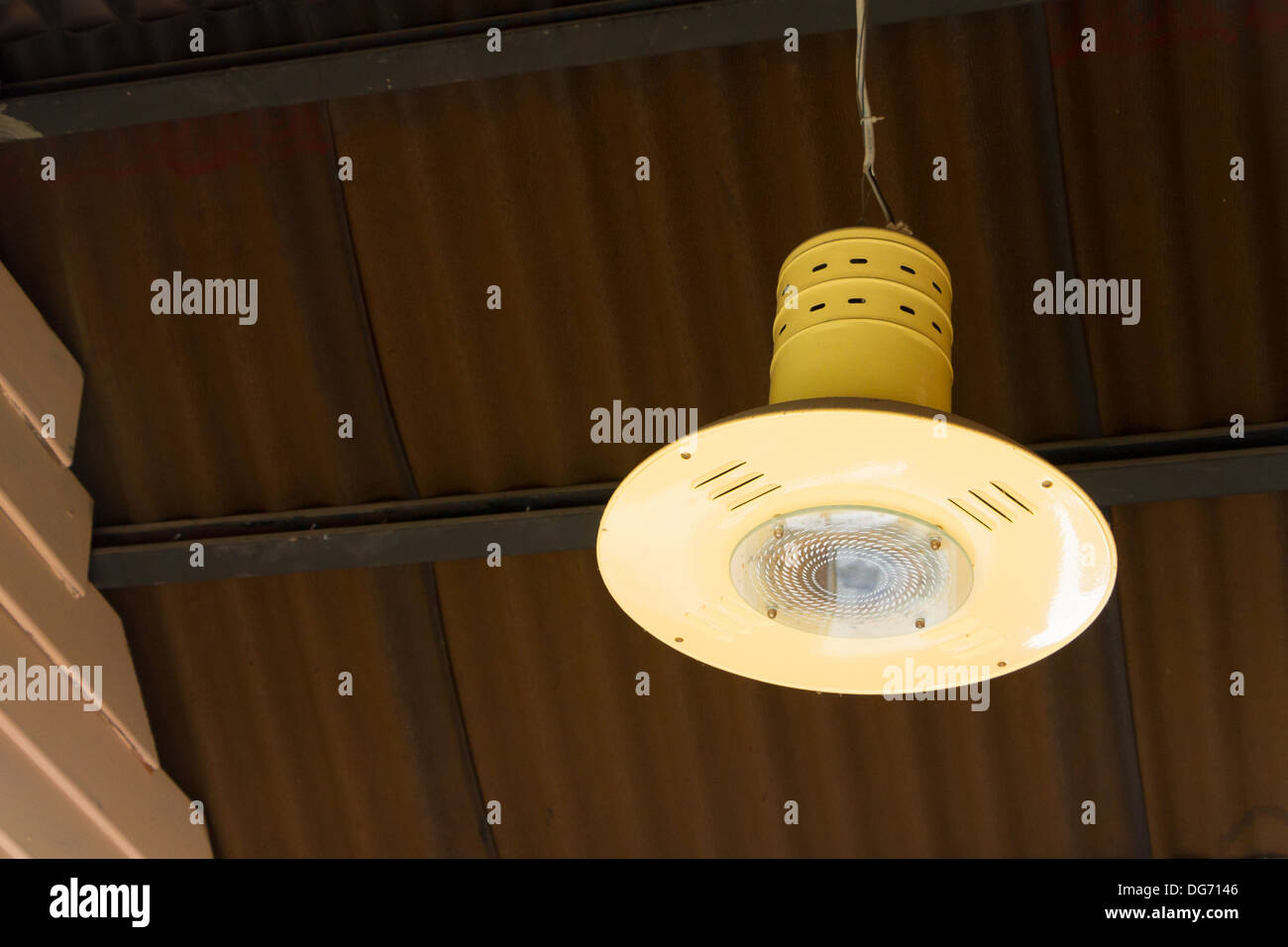 Yellow Retro Lamp post on top Stock Photo - Alamy