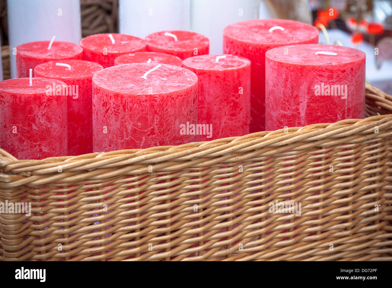 Wicker basket with red round candles in a shop. Horizontal shot Stock ...