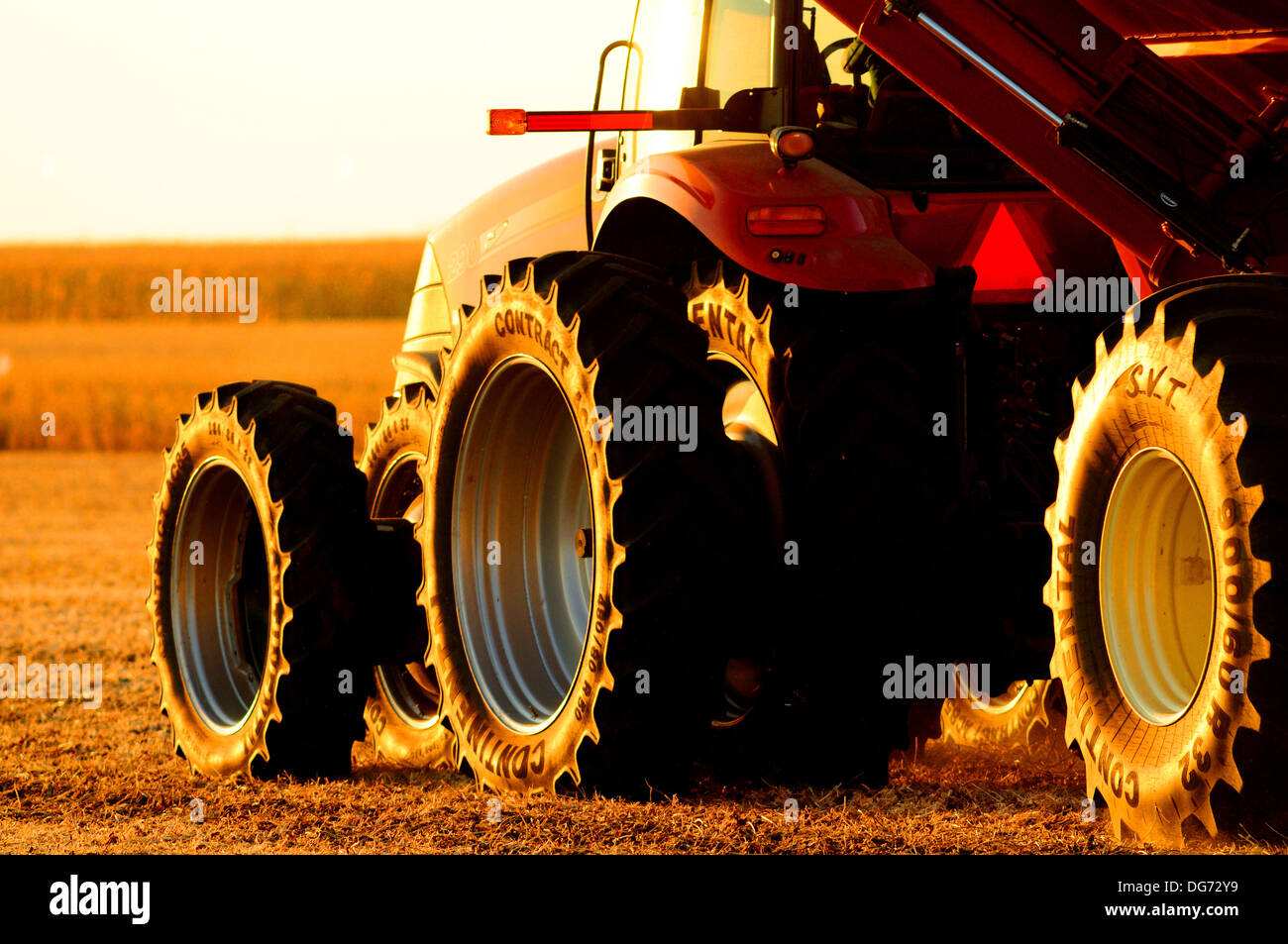 A Case IH tractor pulling a Brent grain wagon during soybean harvest ...